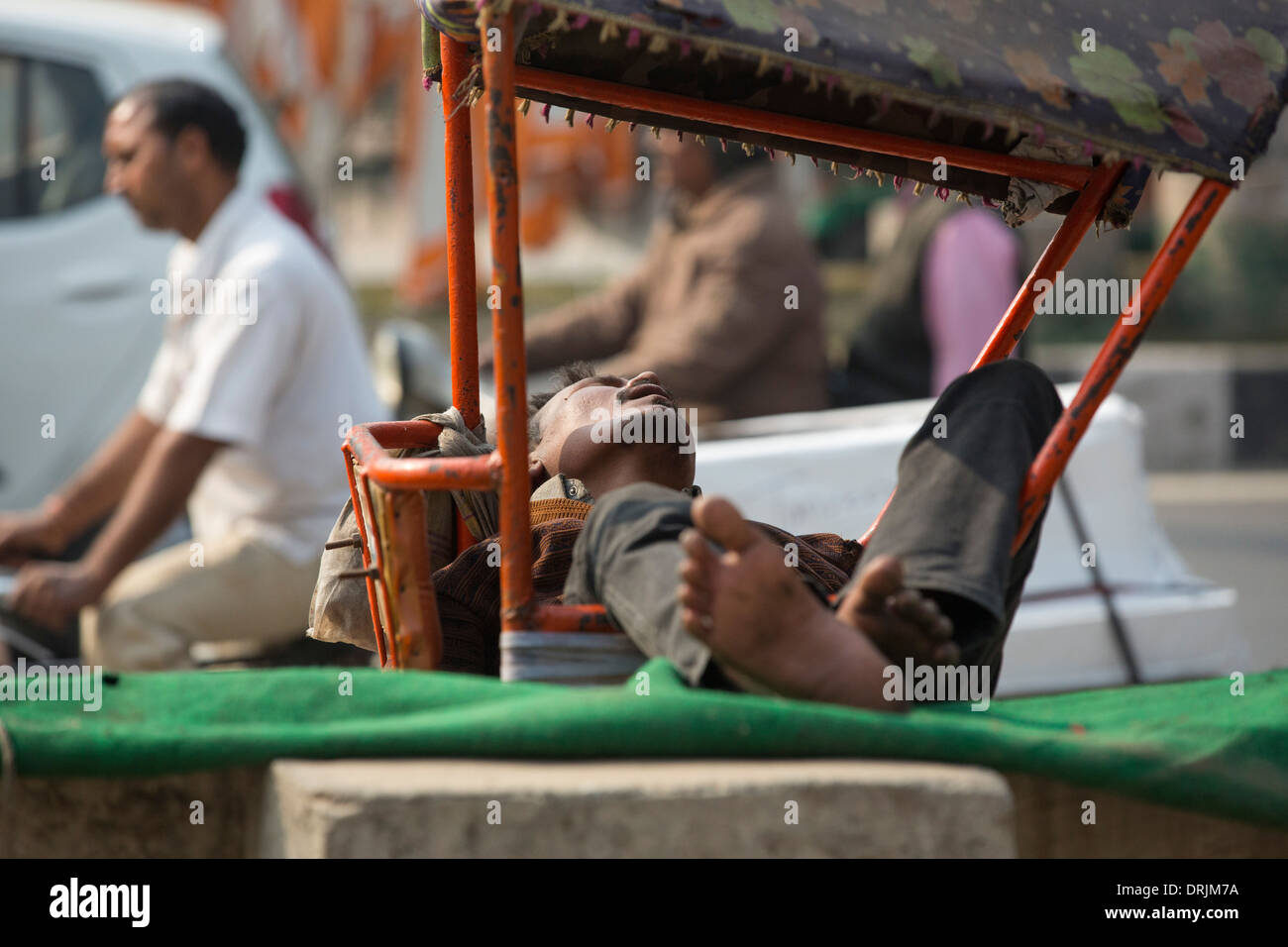 Man sleeping in rickshaw hi-res stock photography and images - Alamy