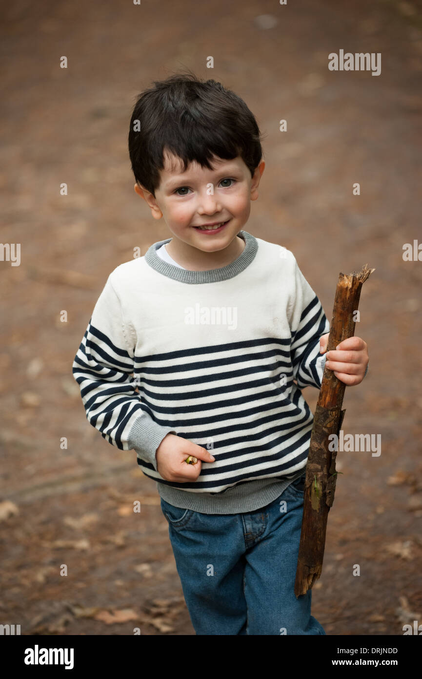 young boy model outdoors in forest enjoying lifestyle aged 4 holding a ...
