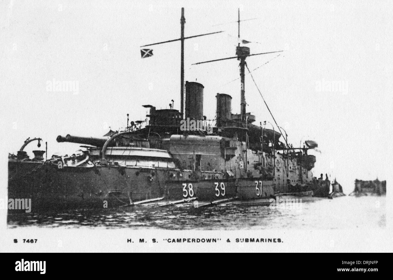 HMS Camperdown with three submarines moored alongside Stock Photo - Alamy