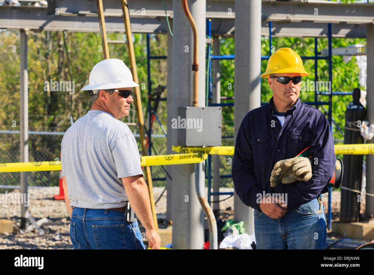 Power engineers at high voltage power distribution station, Braintree ...