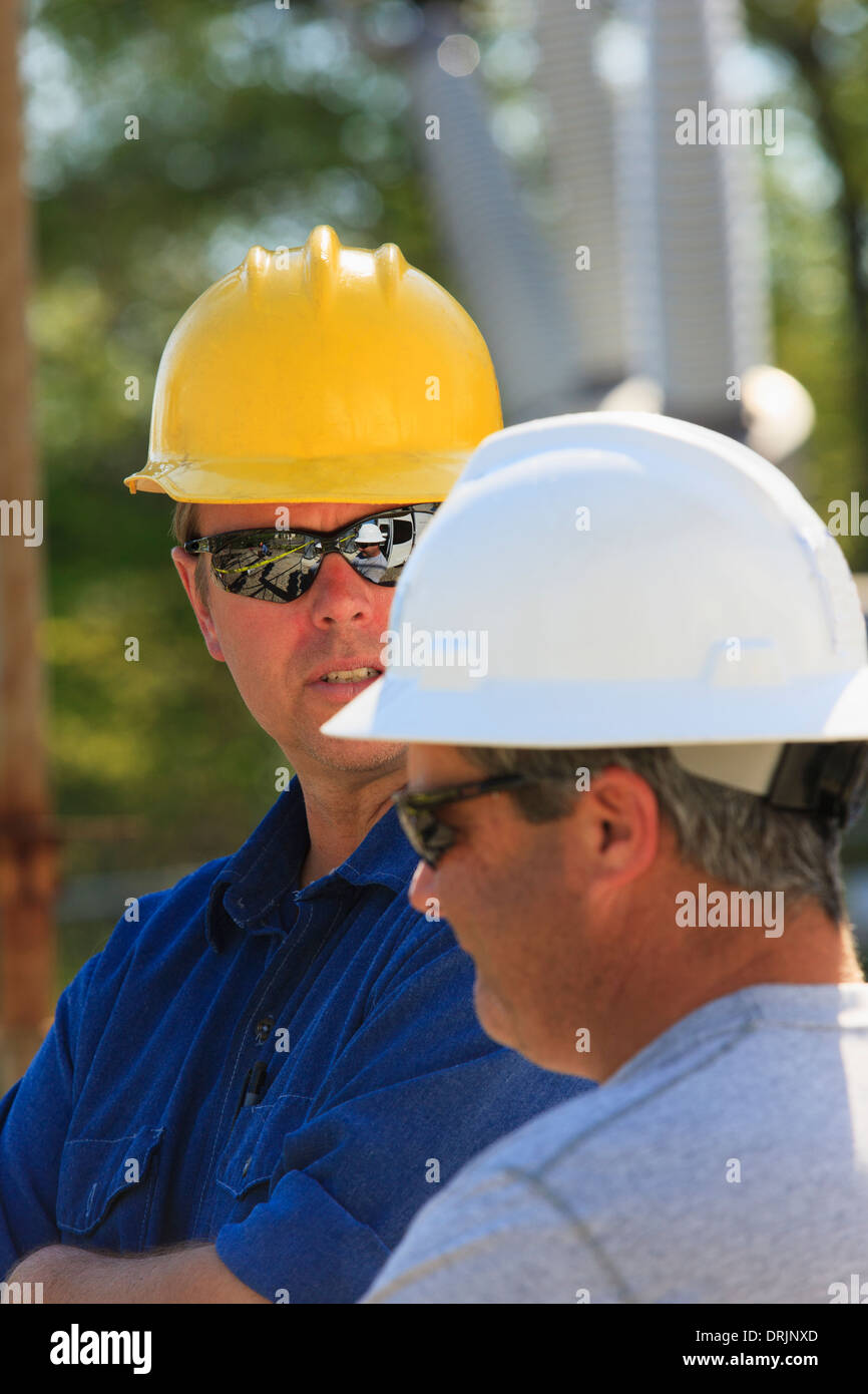 Power engineers at a high voltage distribution station, Braintree ...