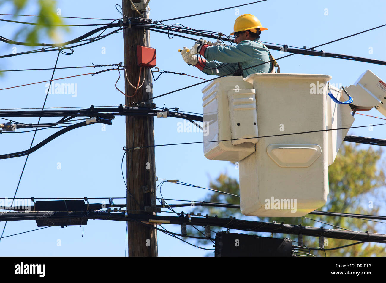 Man working on high voltage power lines hi-res stock photography and ...
