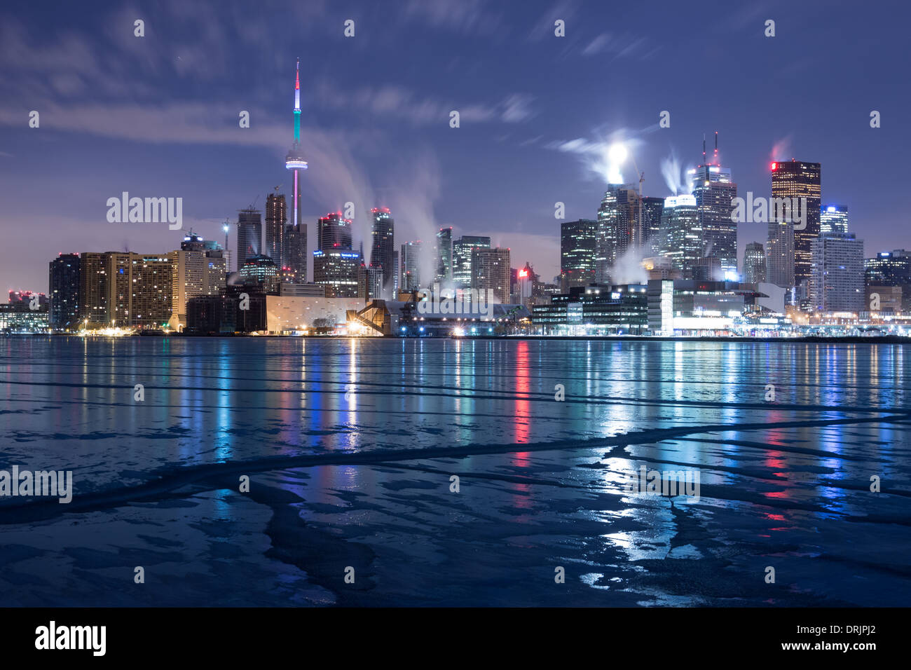 The Toronto skyline overlooks the frozen waters of Lake Ontario during ...