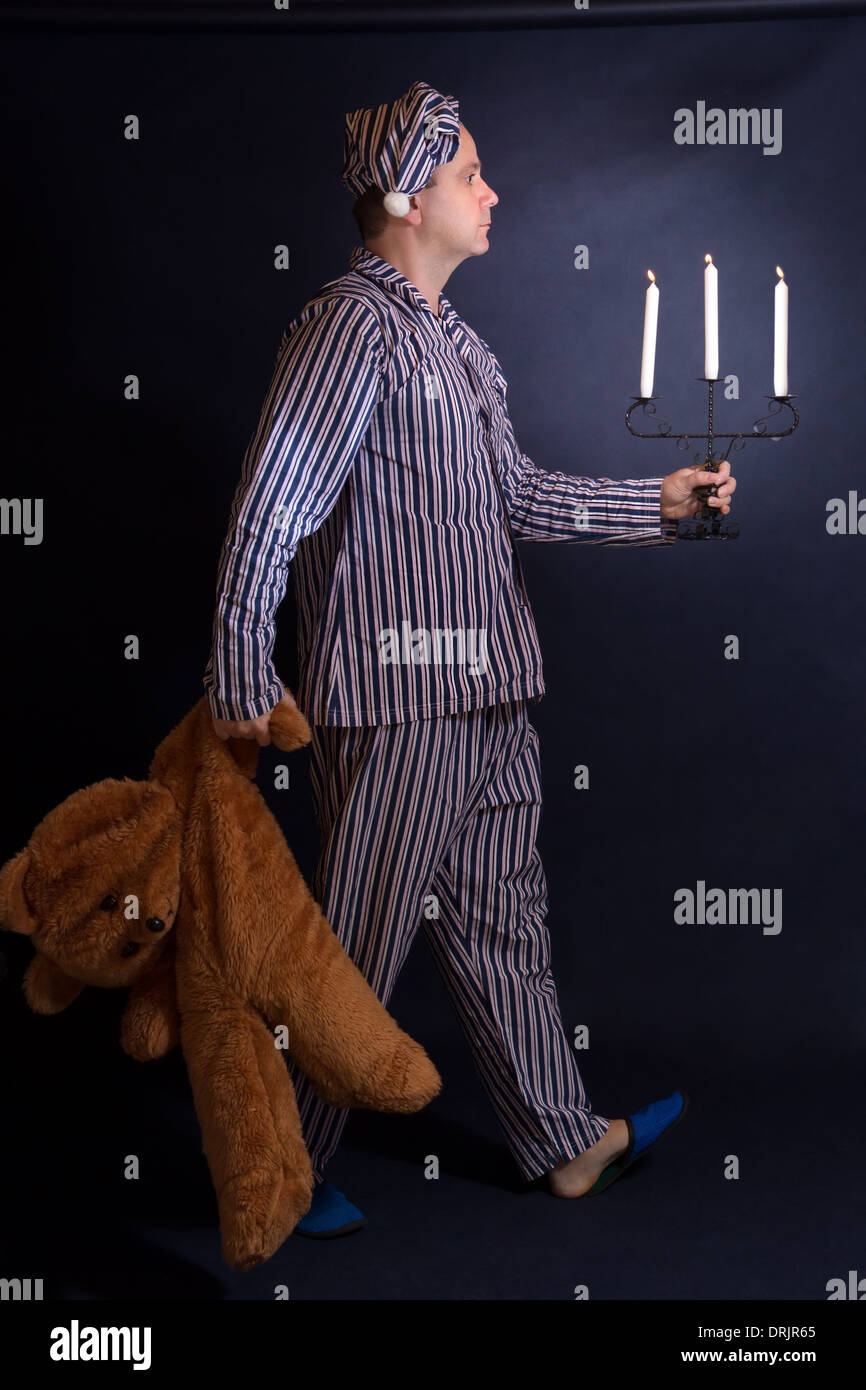 man walking with a candlestick Stock Photo - Alamy