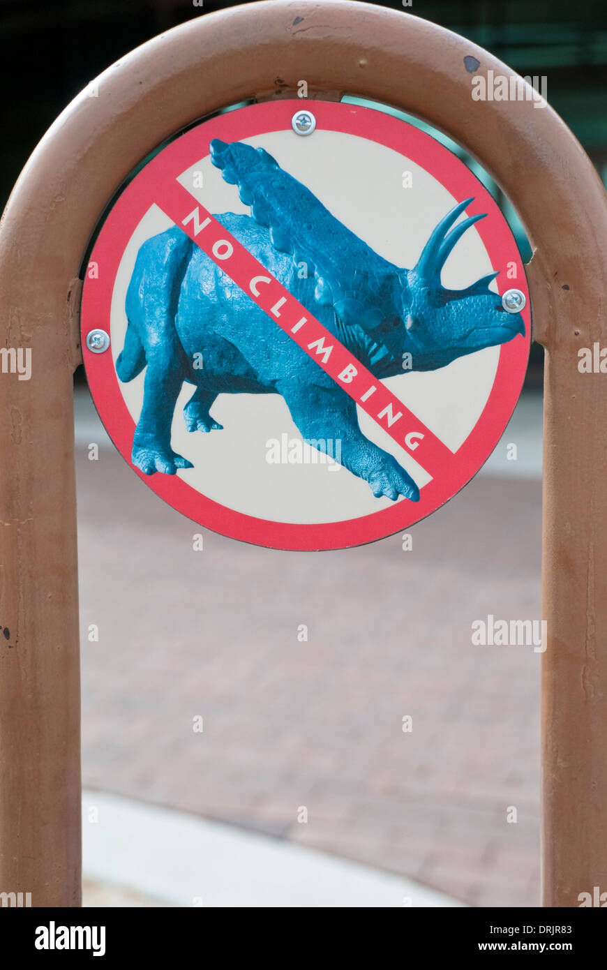 This "No Climbing" sign sits outside the New Mexico Museum of Natural ...