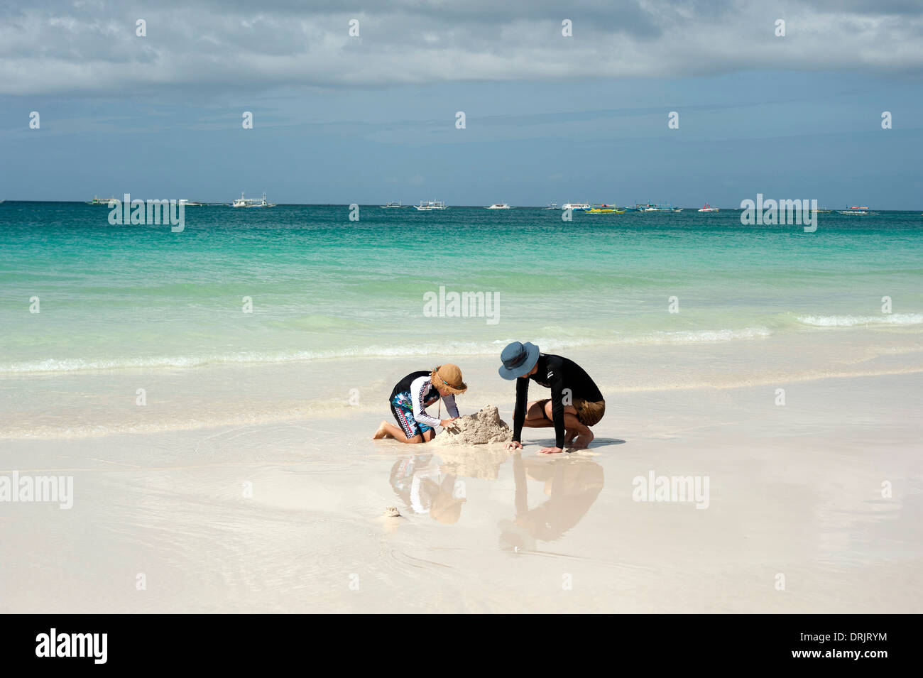 Father & son build a sand castle, Boracay Island, Philippines, South ...