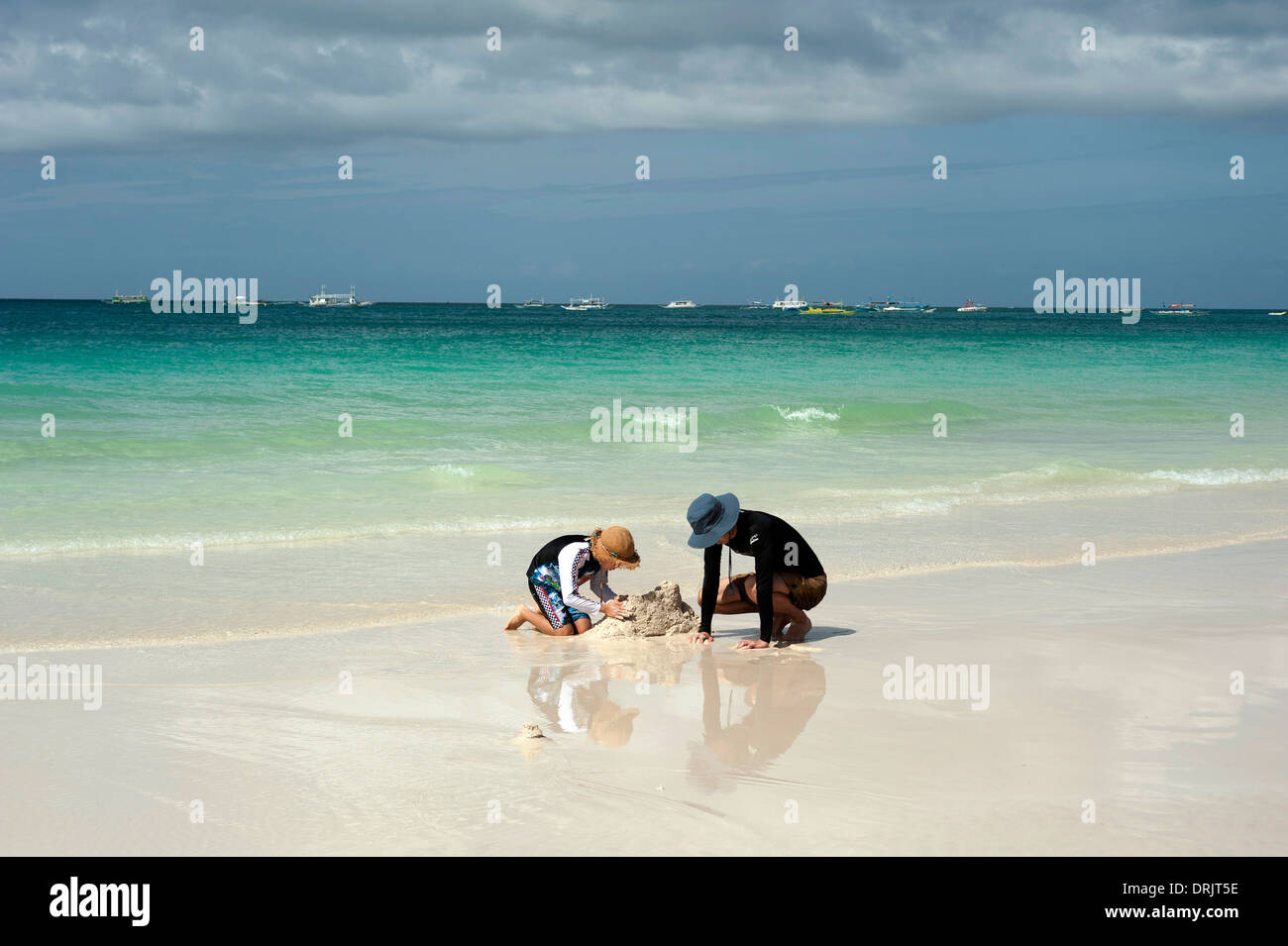 Father & son build a sand castle, Boracay Island, Philippines, South ...