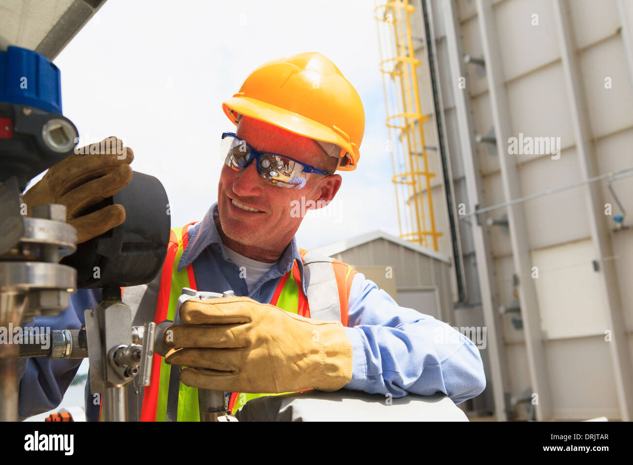 Engineer examining transducer gauge at electric power plant Stock Photo ...