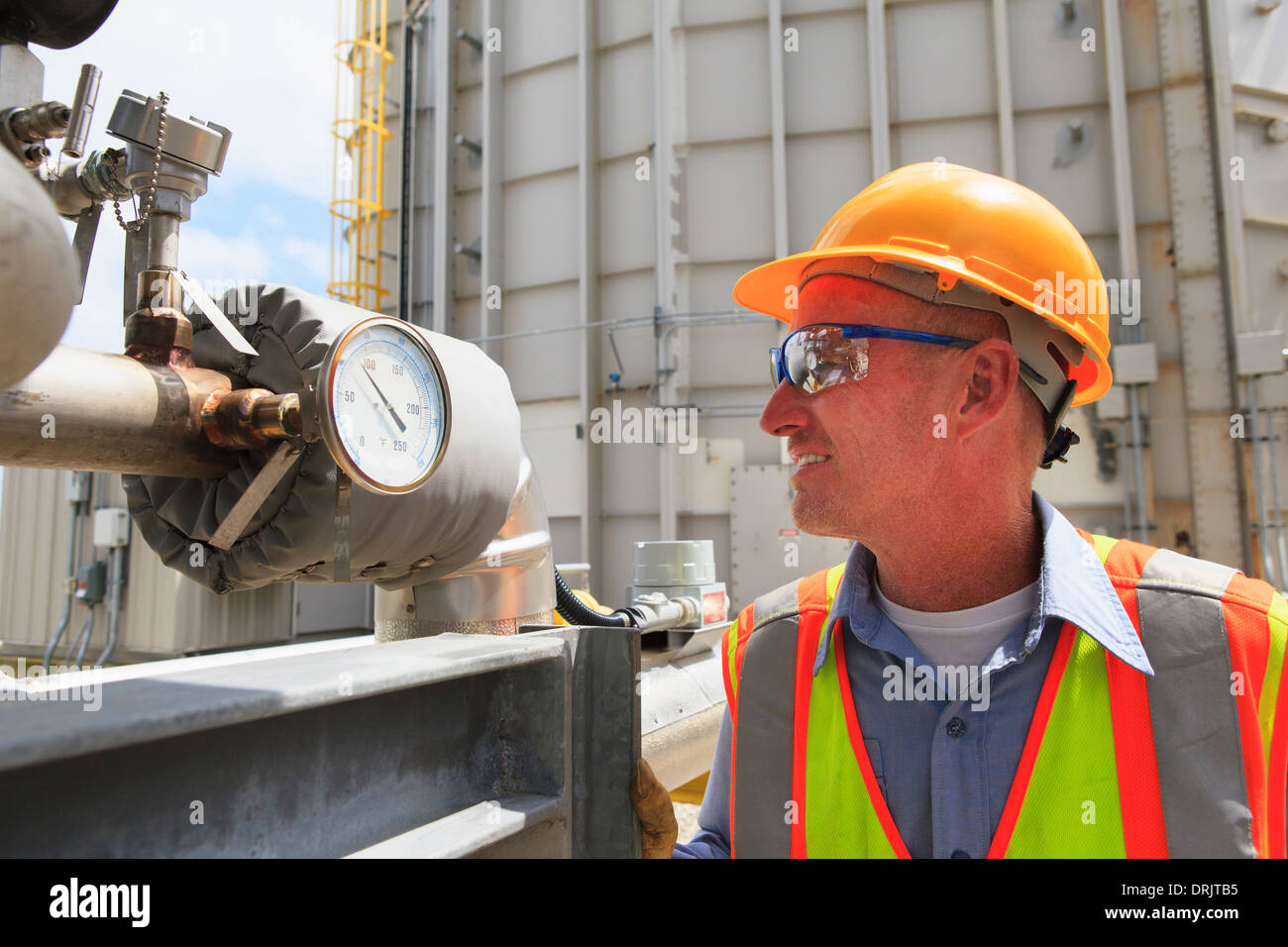 Engineer examining transducer gauge at electric power plant Stock Photo ...