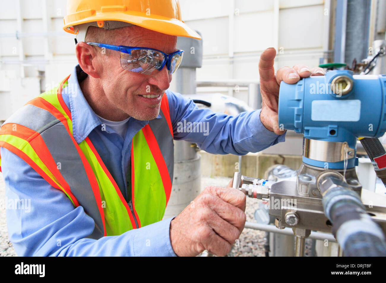 Engineer at electric power plant examining a transducer Stock Photo - Alamy