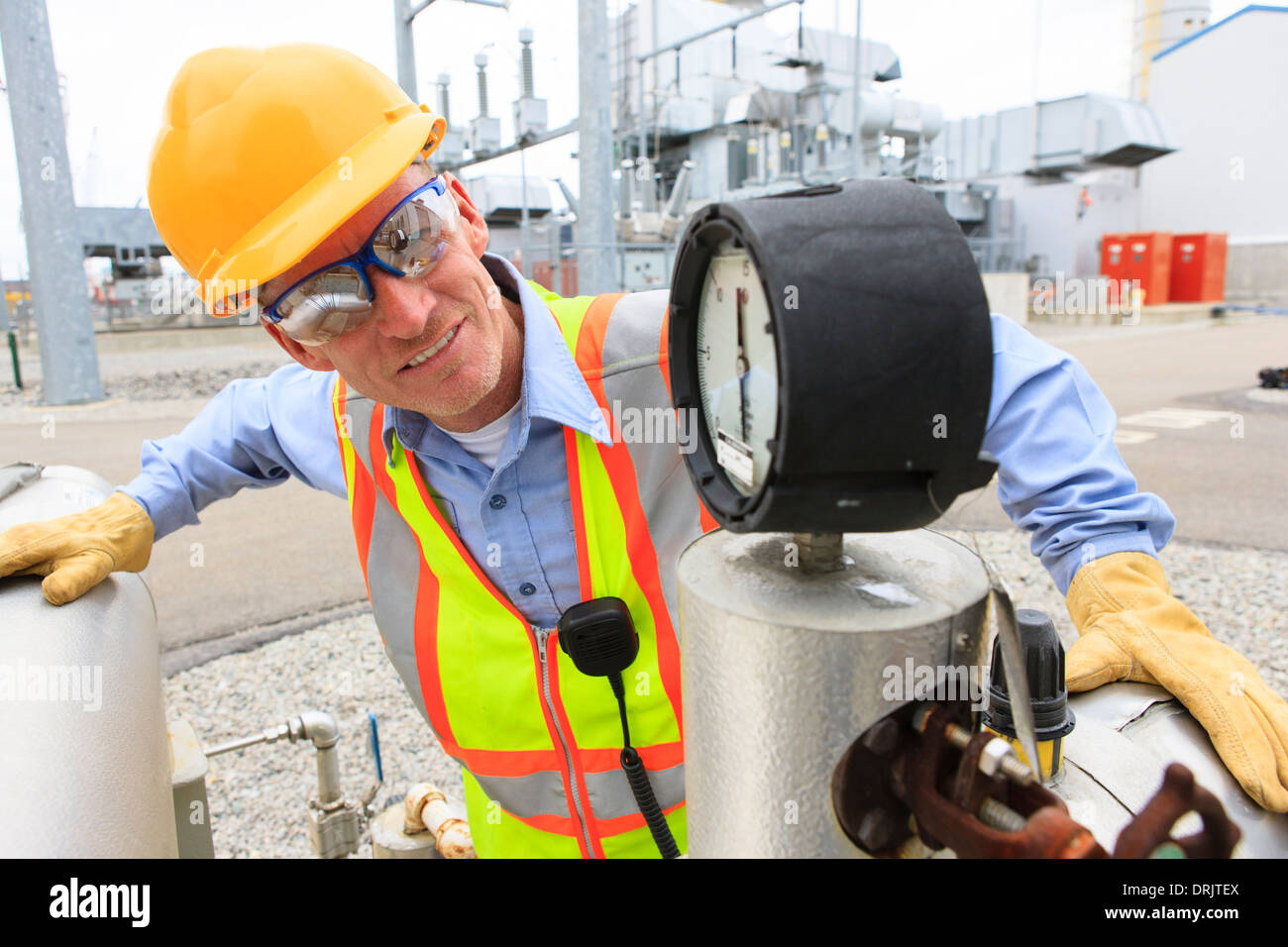 Engineer examining transducer gauge at electric power plant Stock Photo ...
