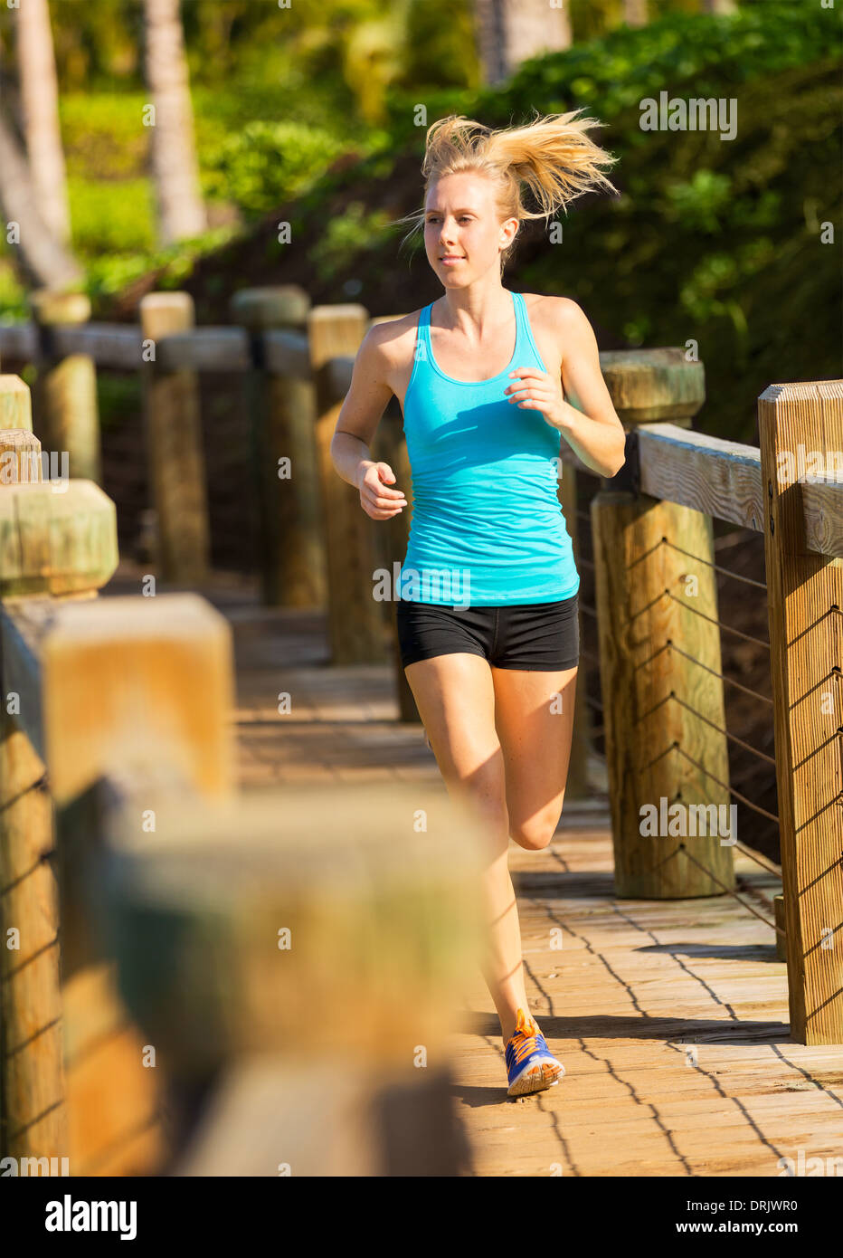 Athletic woman runner outside jogging along path, Healthy lifestyle ...