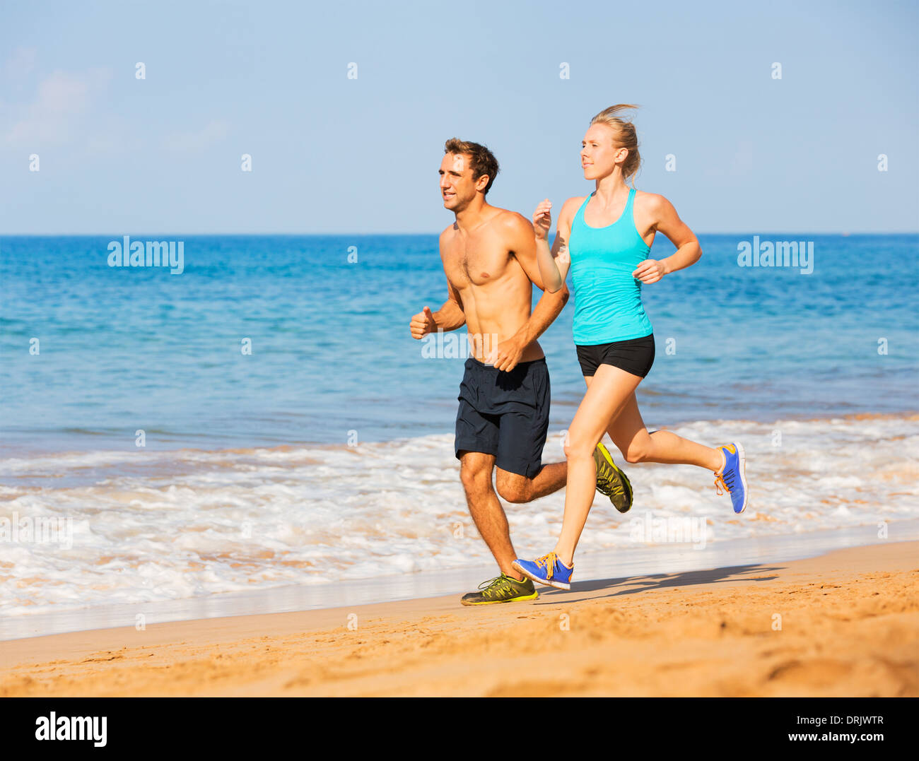 Hawaii couple running on beach hi-res stock photography and images - Alamy