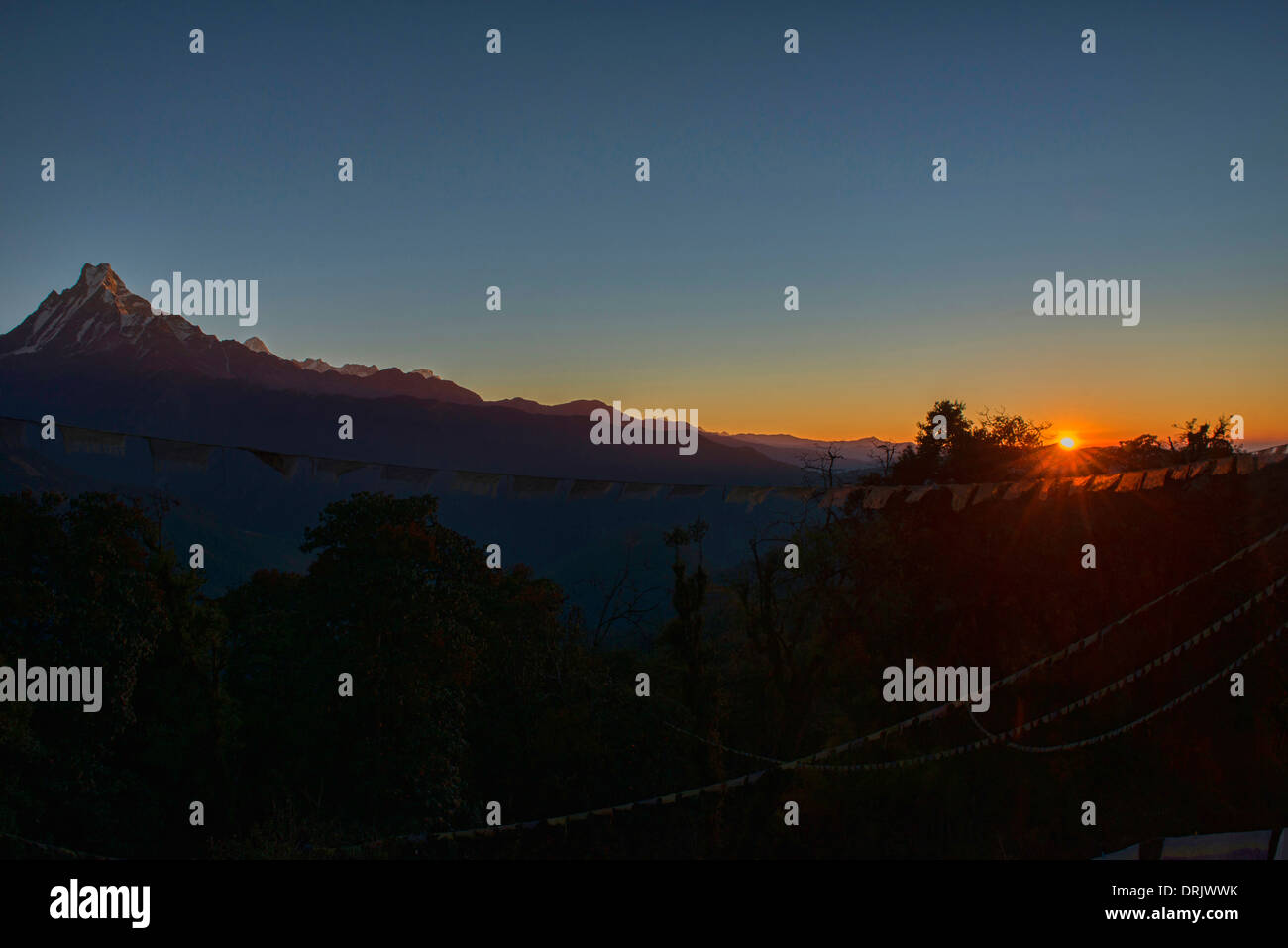 sunrise on Machapuchare (Fishtail peak) in the Annapurna region of ...