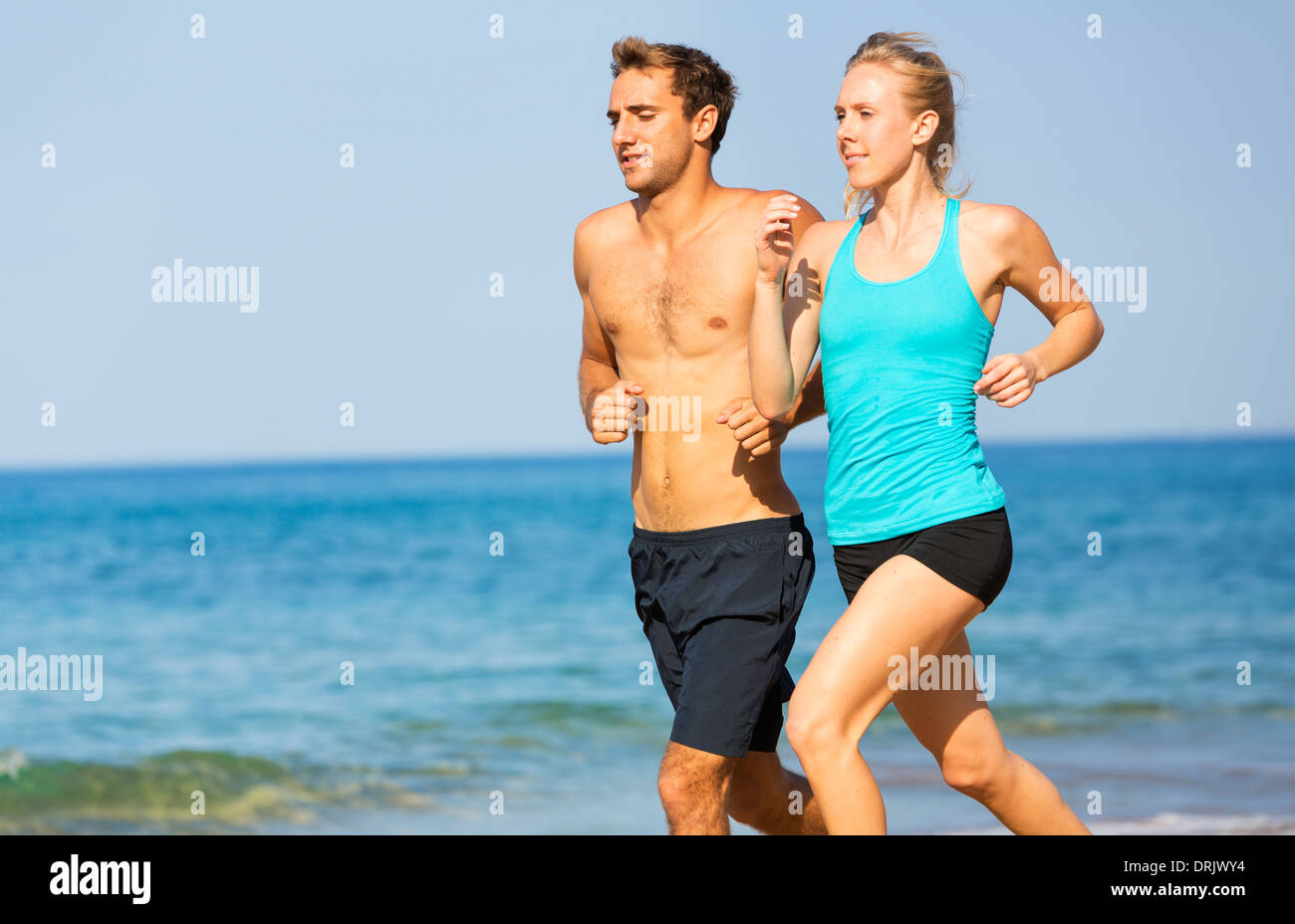 Men run into sea hi-res stock photography and images - Alamy