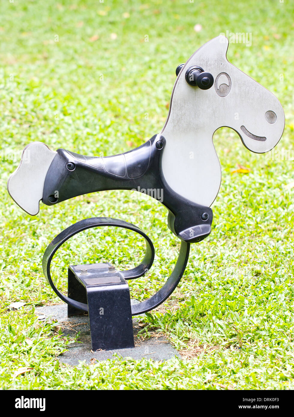 Rocking horse for children in public park Stock Photo - Alamy