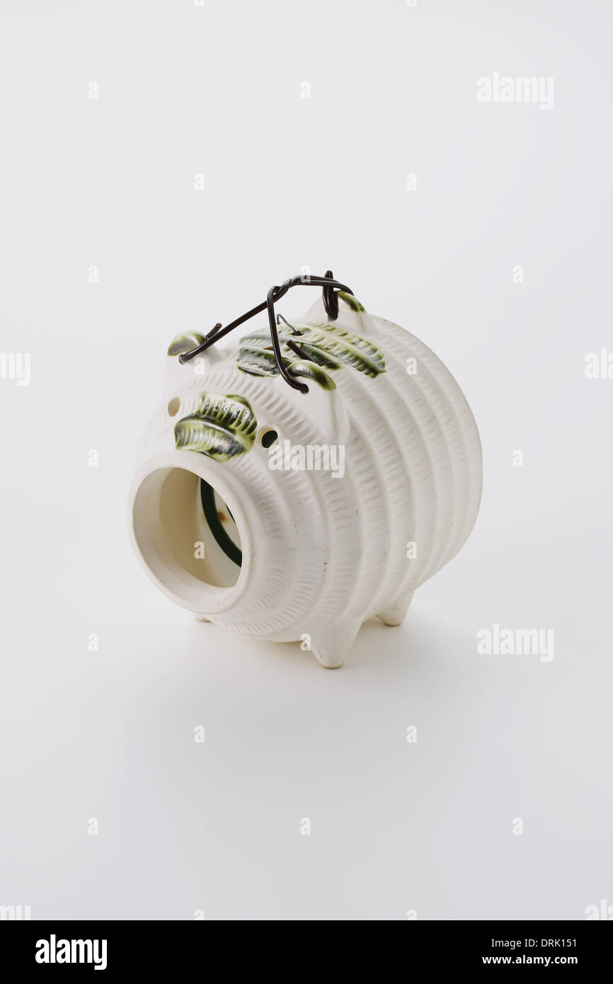 Pig shaped mosquito coil Stock Photo - Alamy