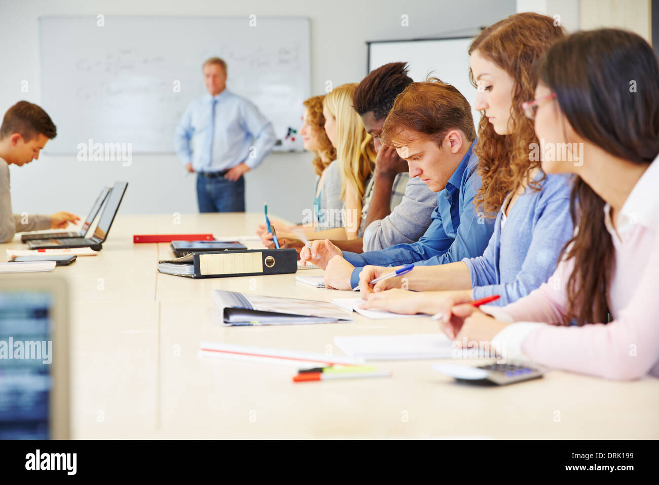 Many different students learning in a class in university Stock Photo ...