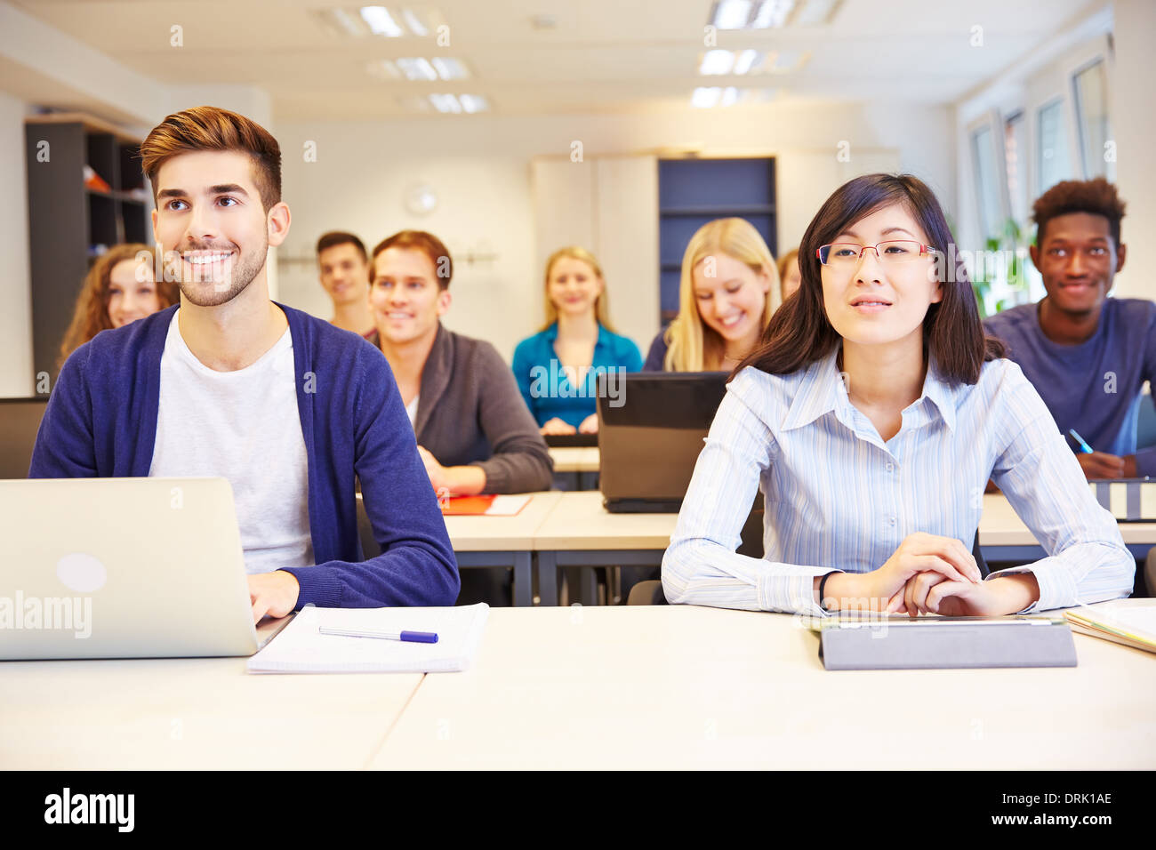 University students smiling in classroom hi-res stock photography and ...
