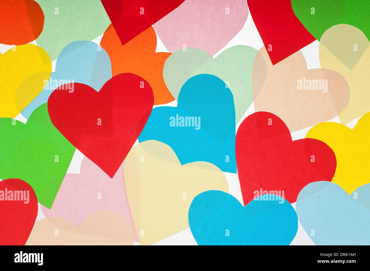 Different color paper hearts on a white background Stock Photo - Alamy