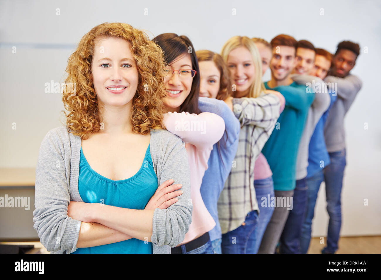Many happy teenager students standing in a row Stock Photo - Alamy