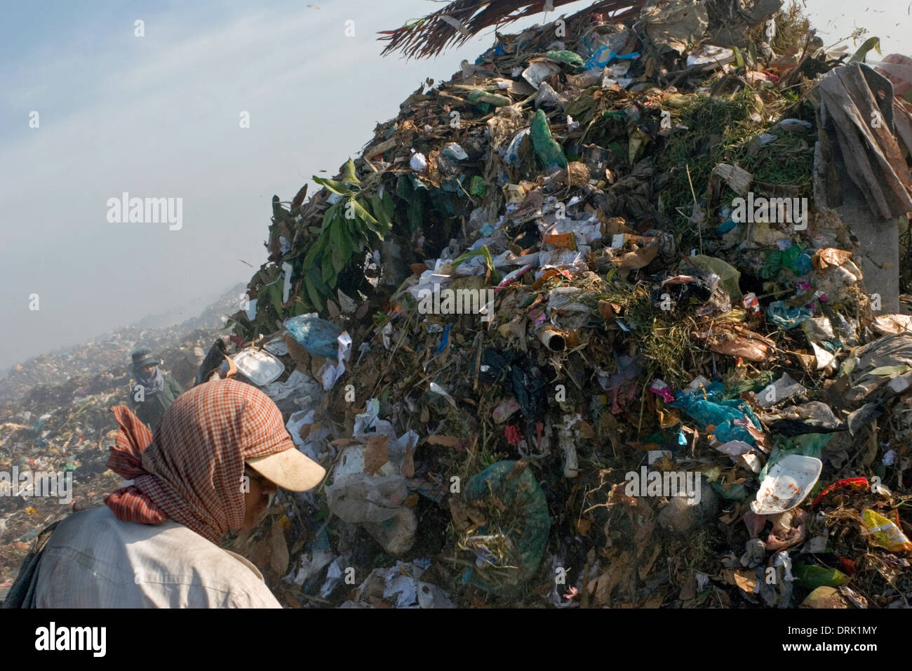 A scavenger man is collecting recyclable material at the toxic Stung ...