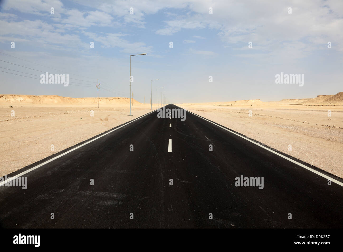 Road through the desert in western Qatar, Middle East Stock Photo - Alamy