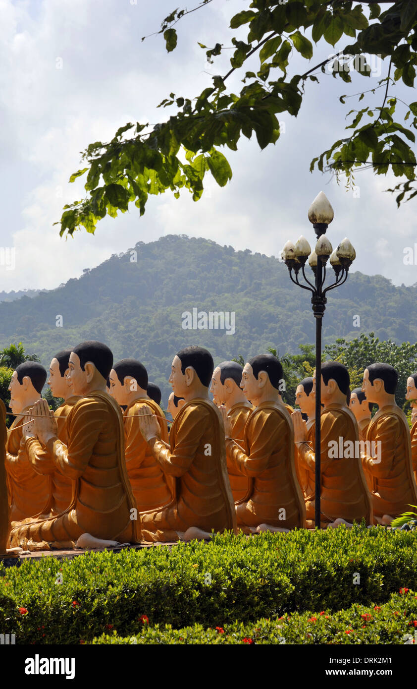 Monk figures praying at the Wat Buddha Park, Wat Chak Yai, at Phliu ...
