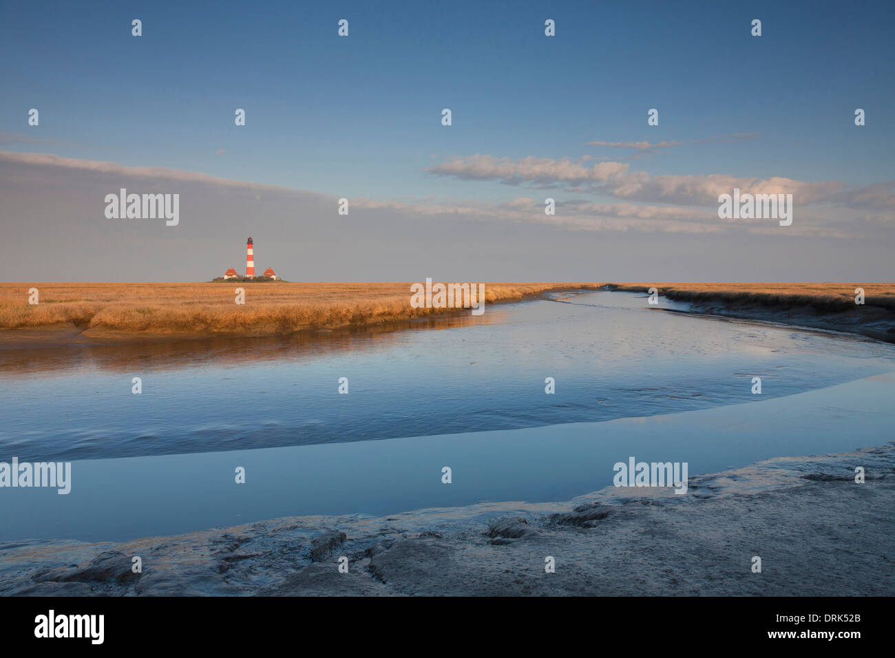 The lighthouse Westerheversand surrounded by salt marsh. Peninsula of ...