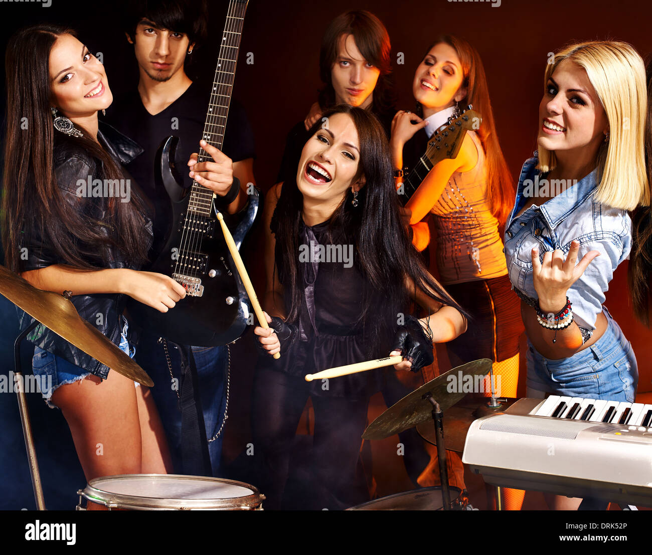 Group people playing guitar in night club Stock Photo - Alamy