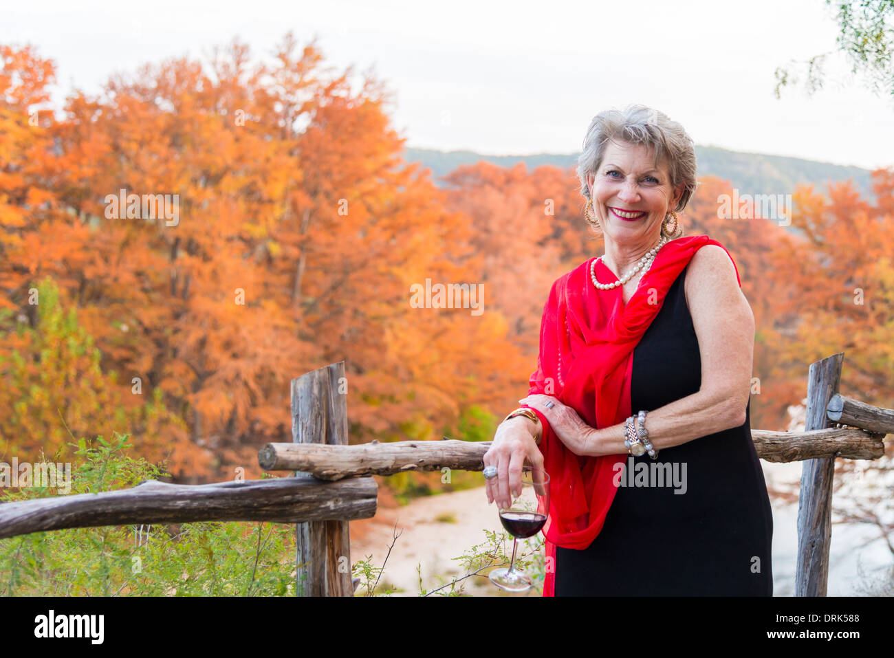 USA, Texas, Mature woman with glass of wine outdoors Stock Photo - Alamy