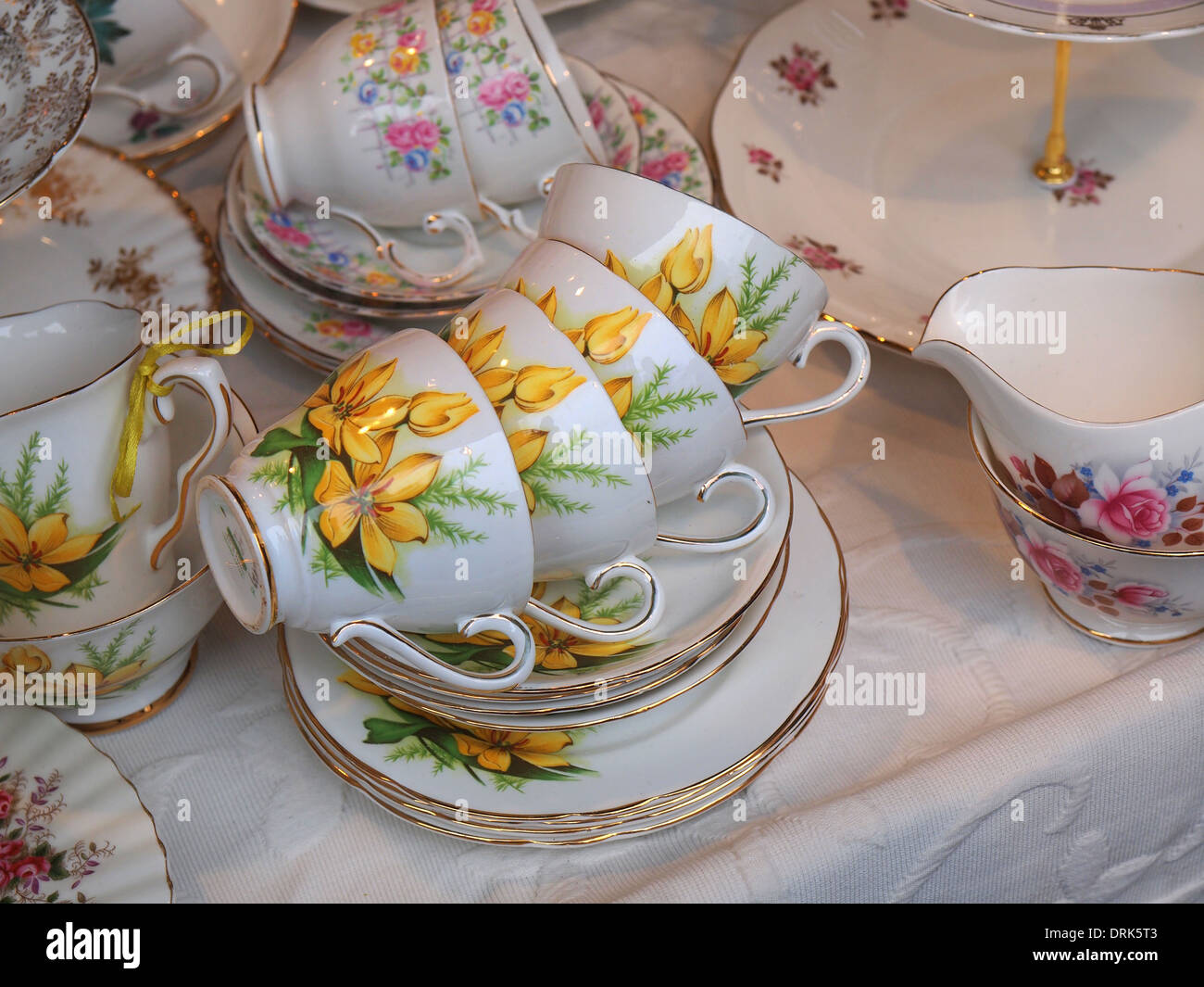 Stack of antique tea cups and plates on white background Stock Photo ...