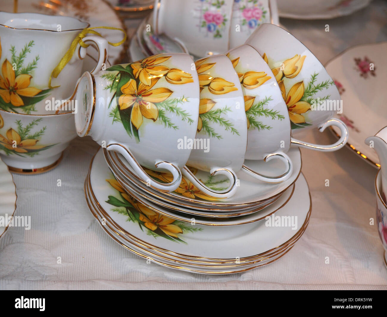 Stack of antique tea cups and plates on white background Stock Photo ...