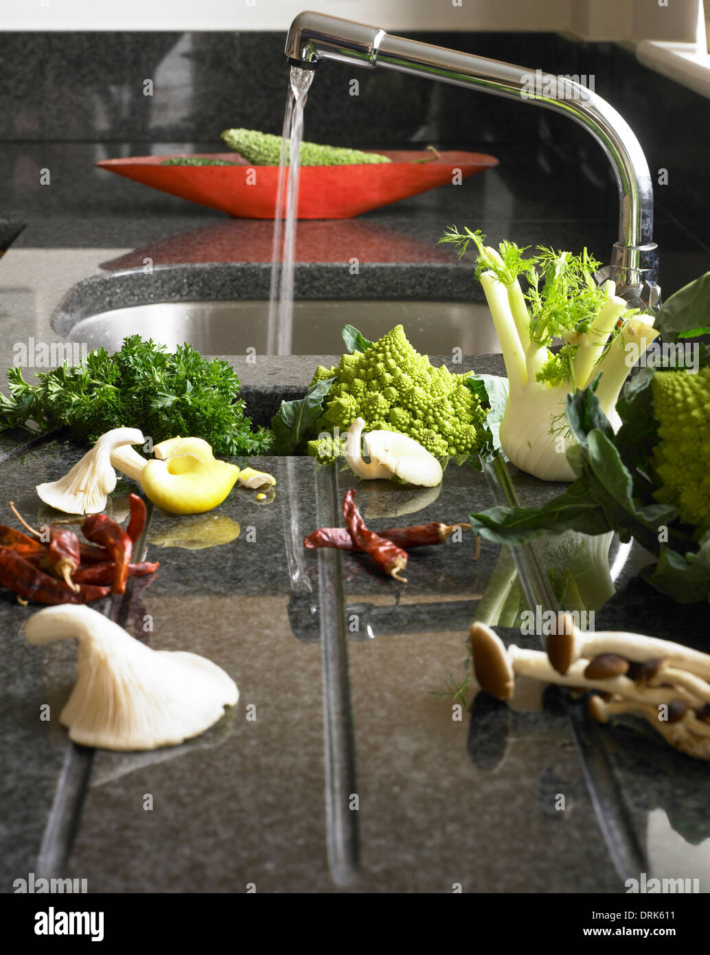 Food preparation at the kitchen sink Stock Photo - Alamy