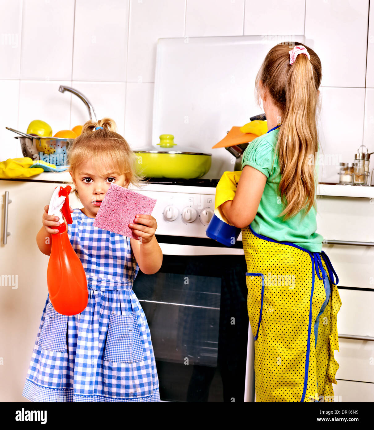 Children cleaning kitchen. Housekeeping Stock Photo - Alamy