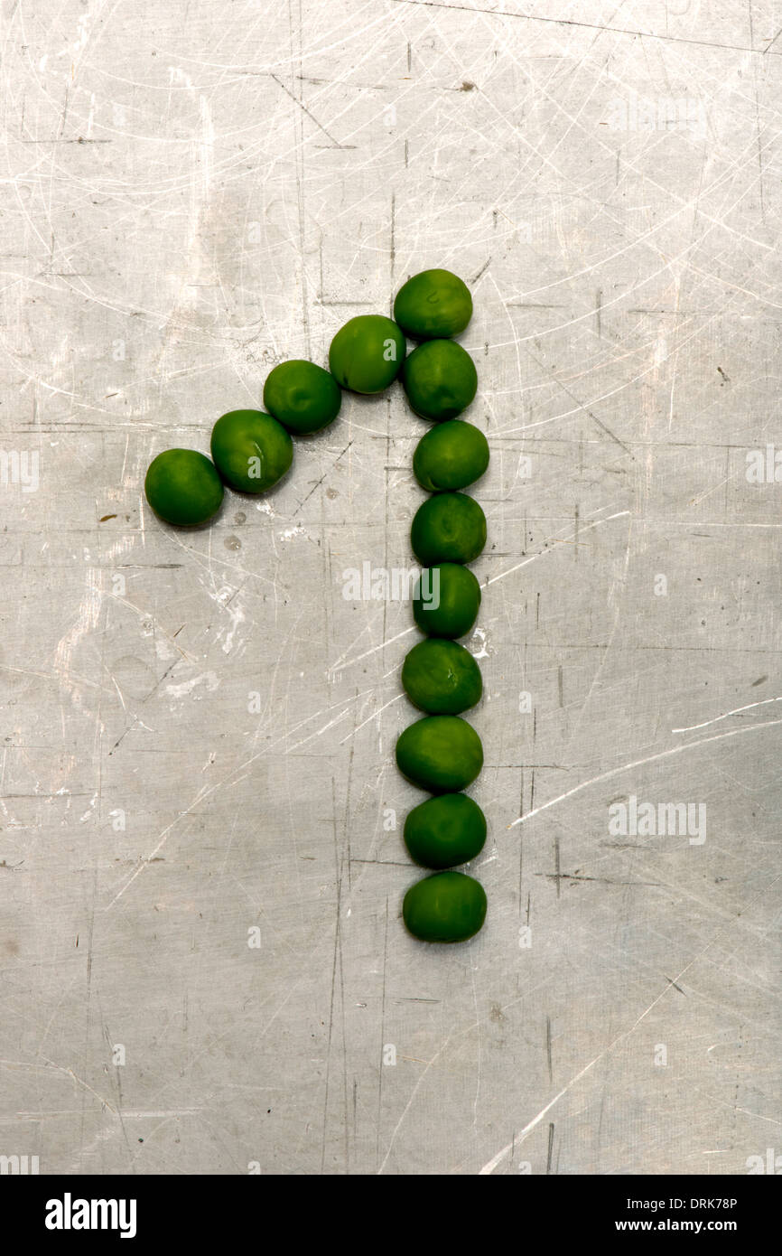 Peas forming number one on sheet metal Stock Photo - Alamy