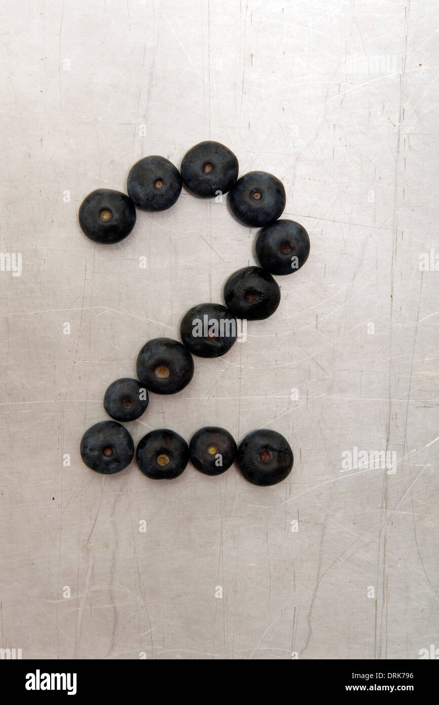 Blueberries forming number two on sheet metal Stock Photo - Alamy
