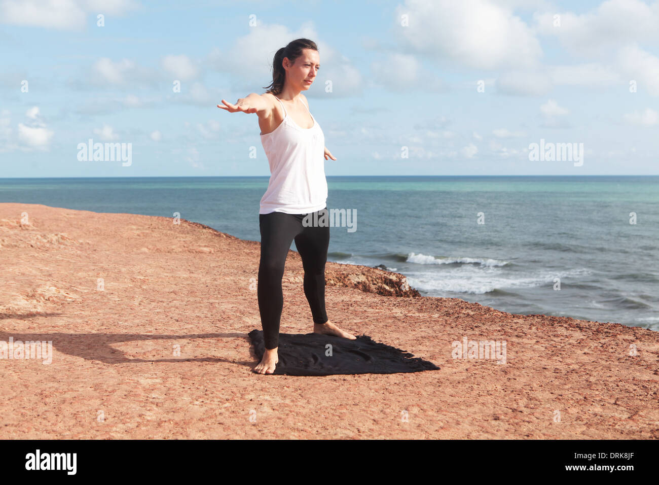 yoga exercise on a cliff Stock Photo - Alamy