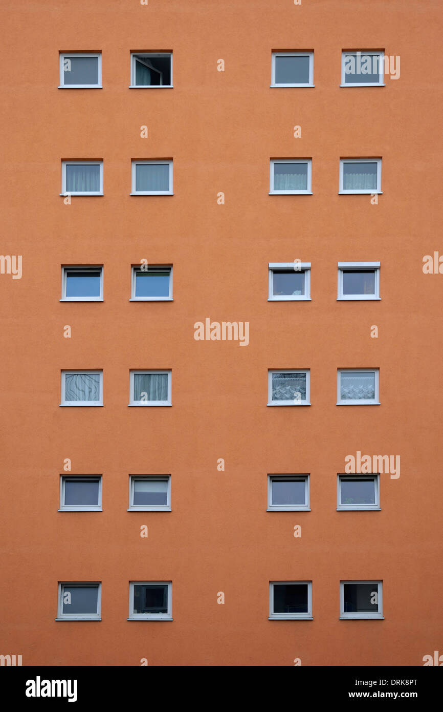 Orange house facade with squared windows Stock Photo - Alamy