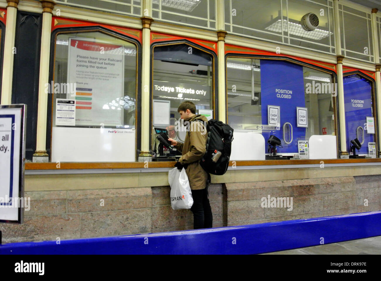 Bristol Temple Meads man buying a ticket in the booking hall of the ...