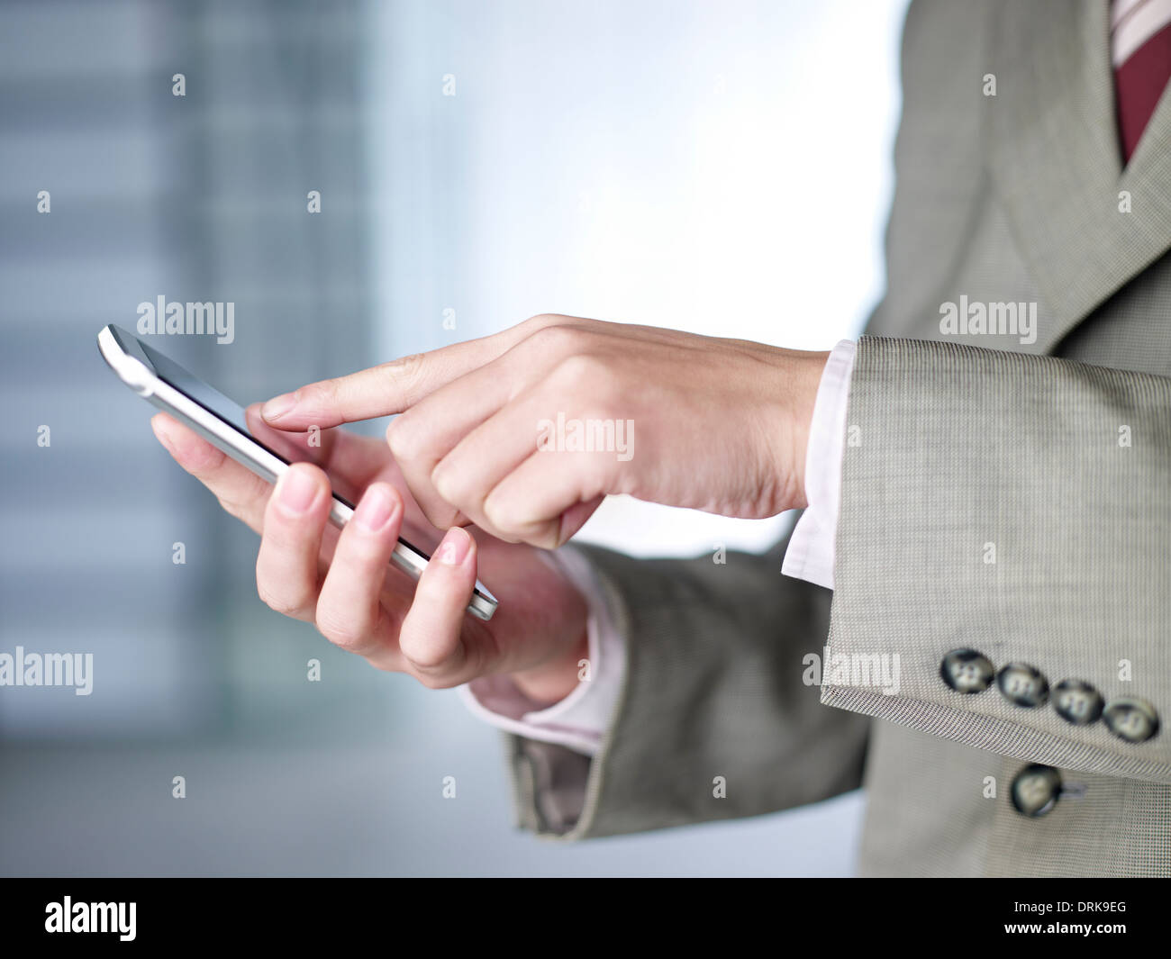 Asian businessman looking smartphone hi-res stock photography and ...