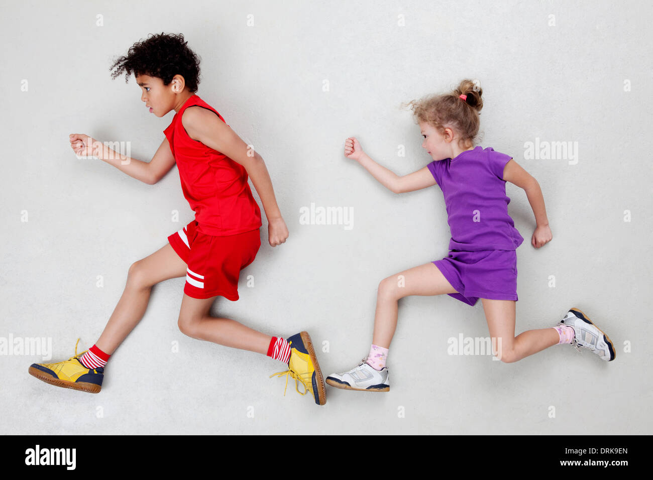 Boy and girl running Stock Photo - Alamy