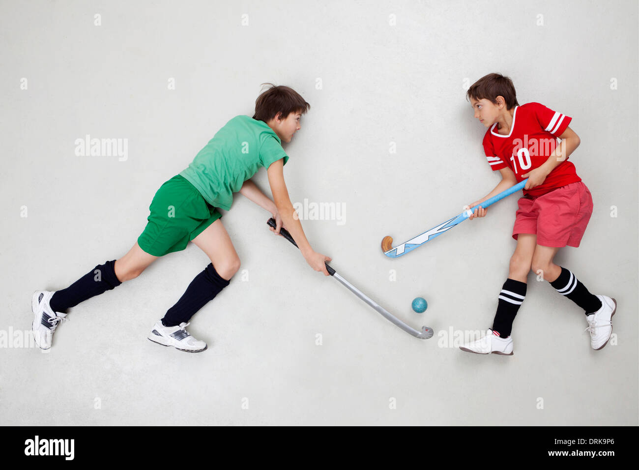 Boys playing hockey Stock Photo - Alamy