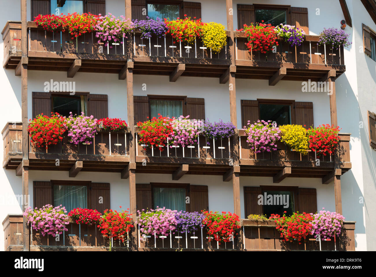 Rustic windows decorated with flowers in Madonna di Campiglio Stock ...