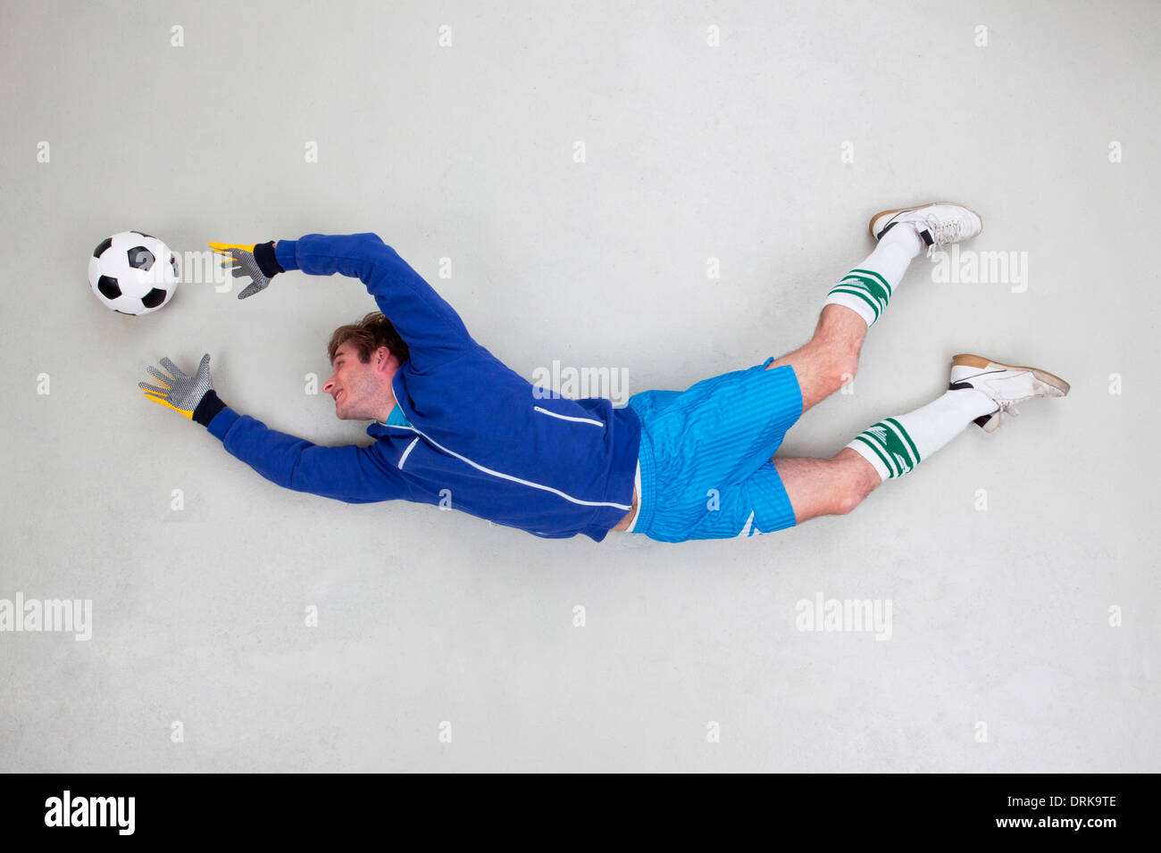 Full length lying down football hi-res stock photography and images - Alamy