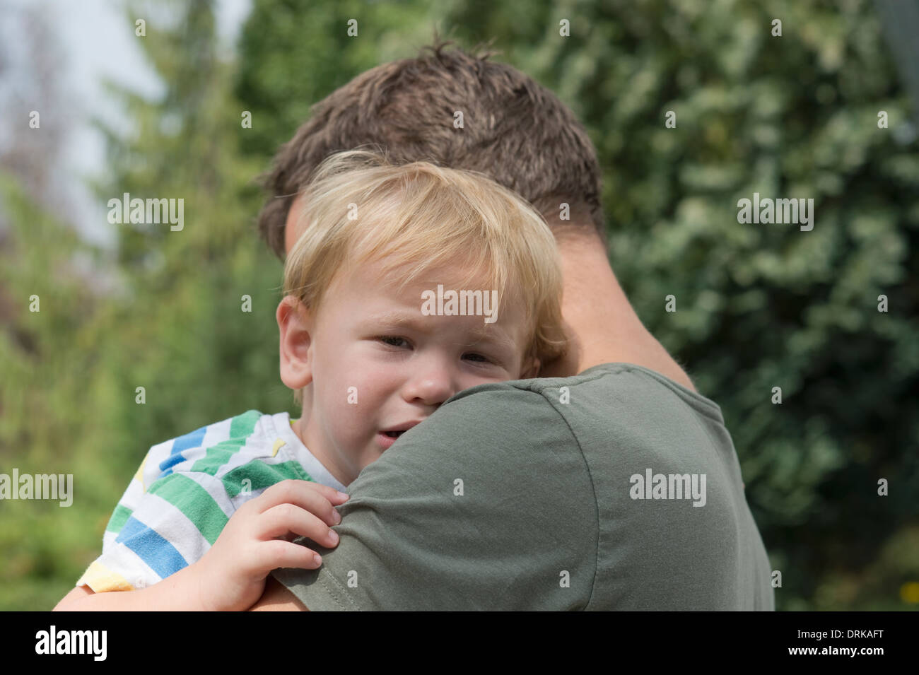 Parents consoling sad child hi-res stock photography and images - Alamy