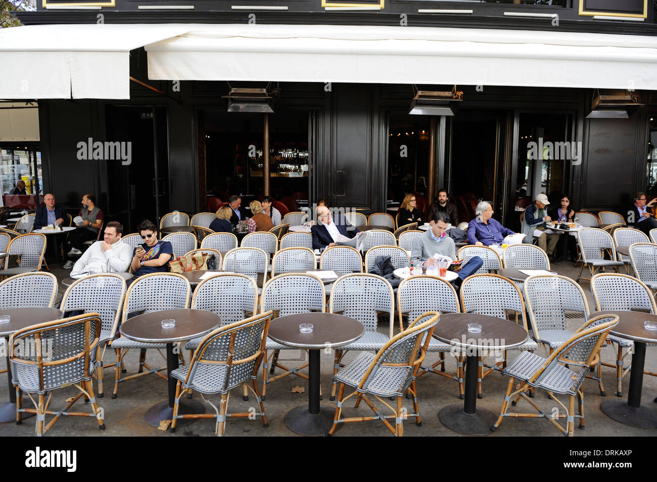 Stock photo of people sitting outside in a parisian cafe Stock Photo ...