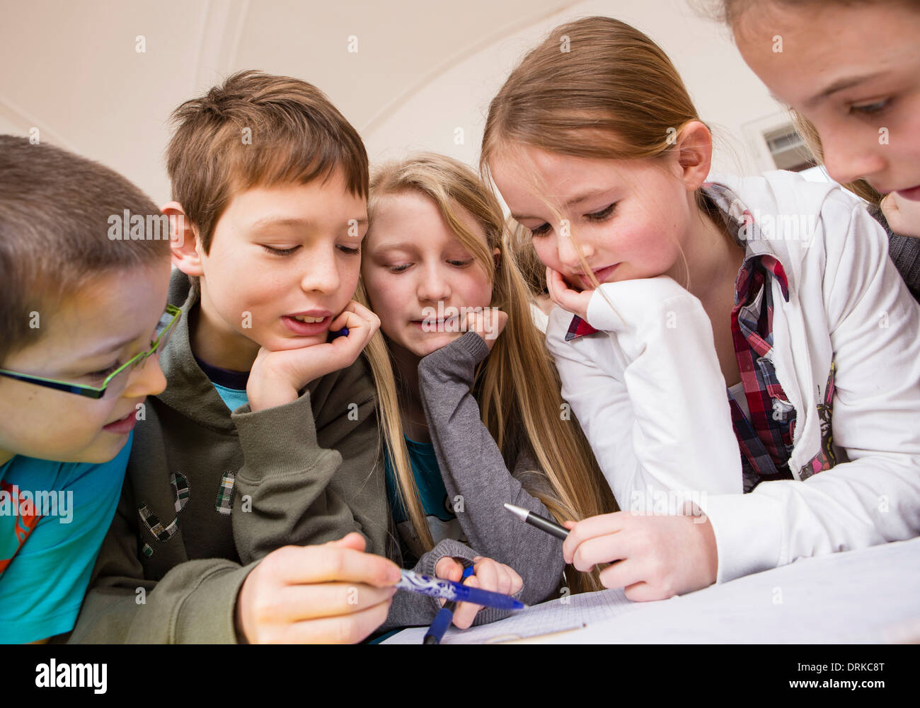 Austria, Group of children learning together Stock Photo - Alamy