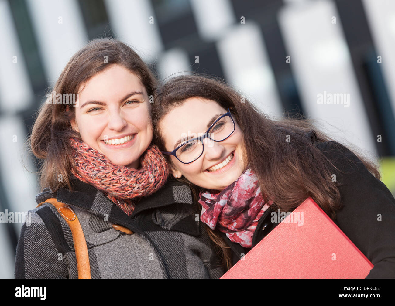 Two students with folder outdoors hi-res stock photography and images ...