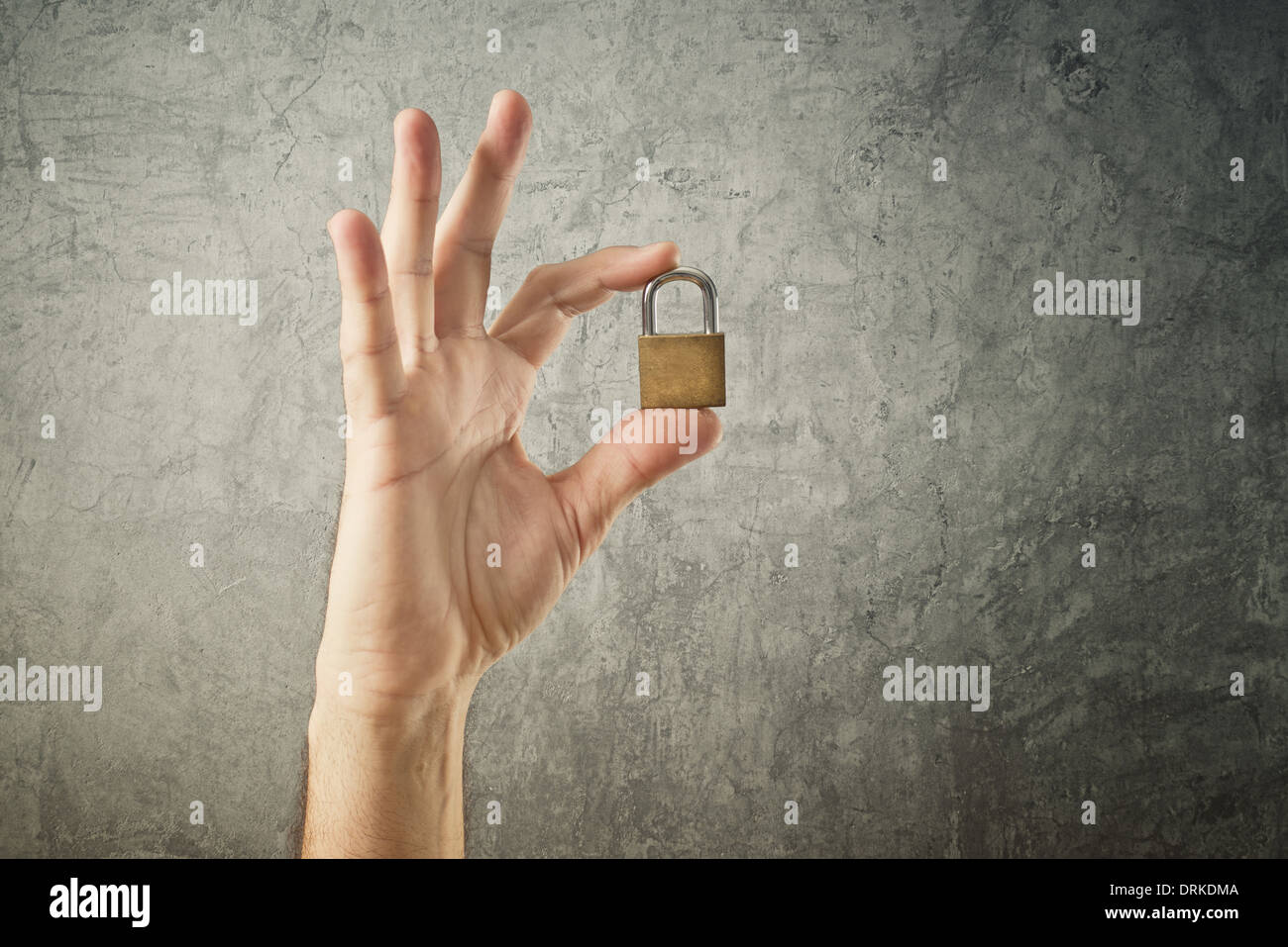 Hand holding locked padlock. Security and insurance concept Stock Photo ...